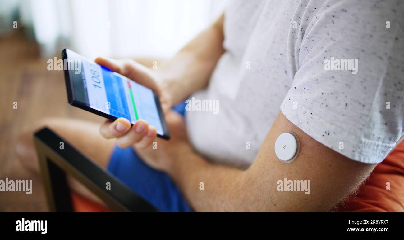 Man Using Continuous Glucose Remote Monitor Diabetes Sensor Stock Photo ...