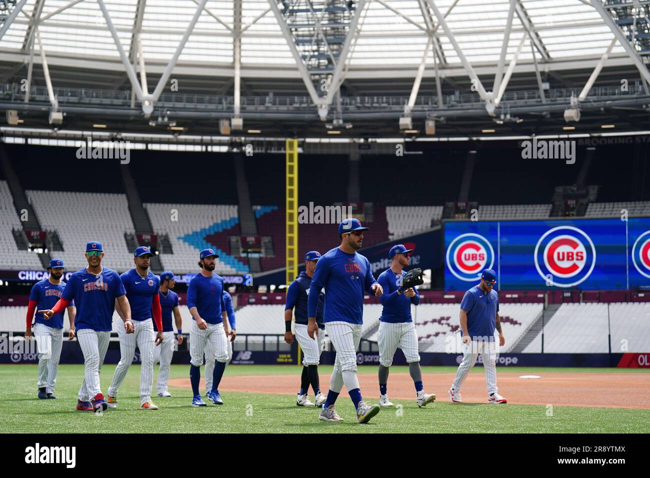 A general view as Chicago Cubs start their warm up during a workout day ...