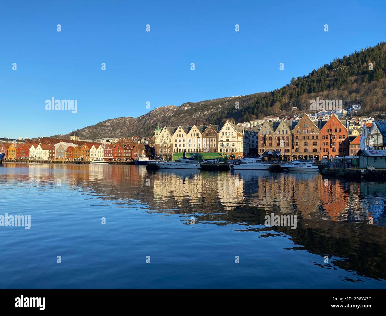 A landscape of a port surrounded by buildings in Bergen, Norway Stock ...