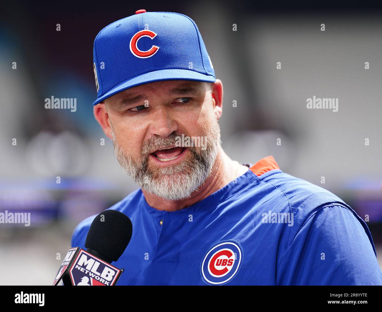 Chicago Cubs Manager, David Ross, looks on while giving an interview ...