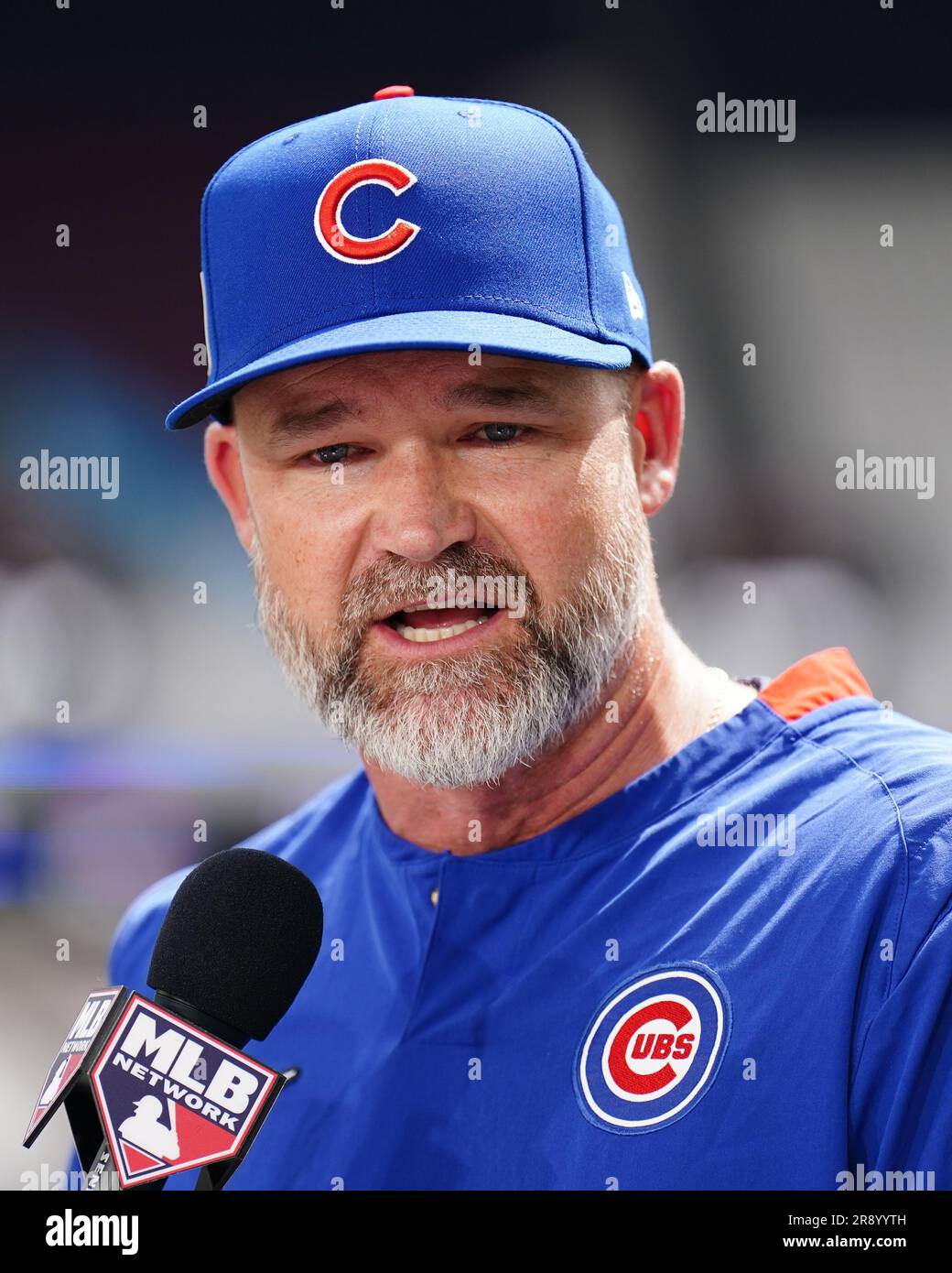 Chicago Cubs Manager, David Ross, looks on while giving an interview ...
