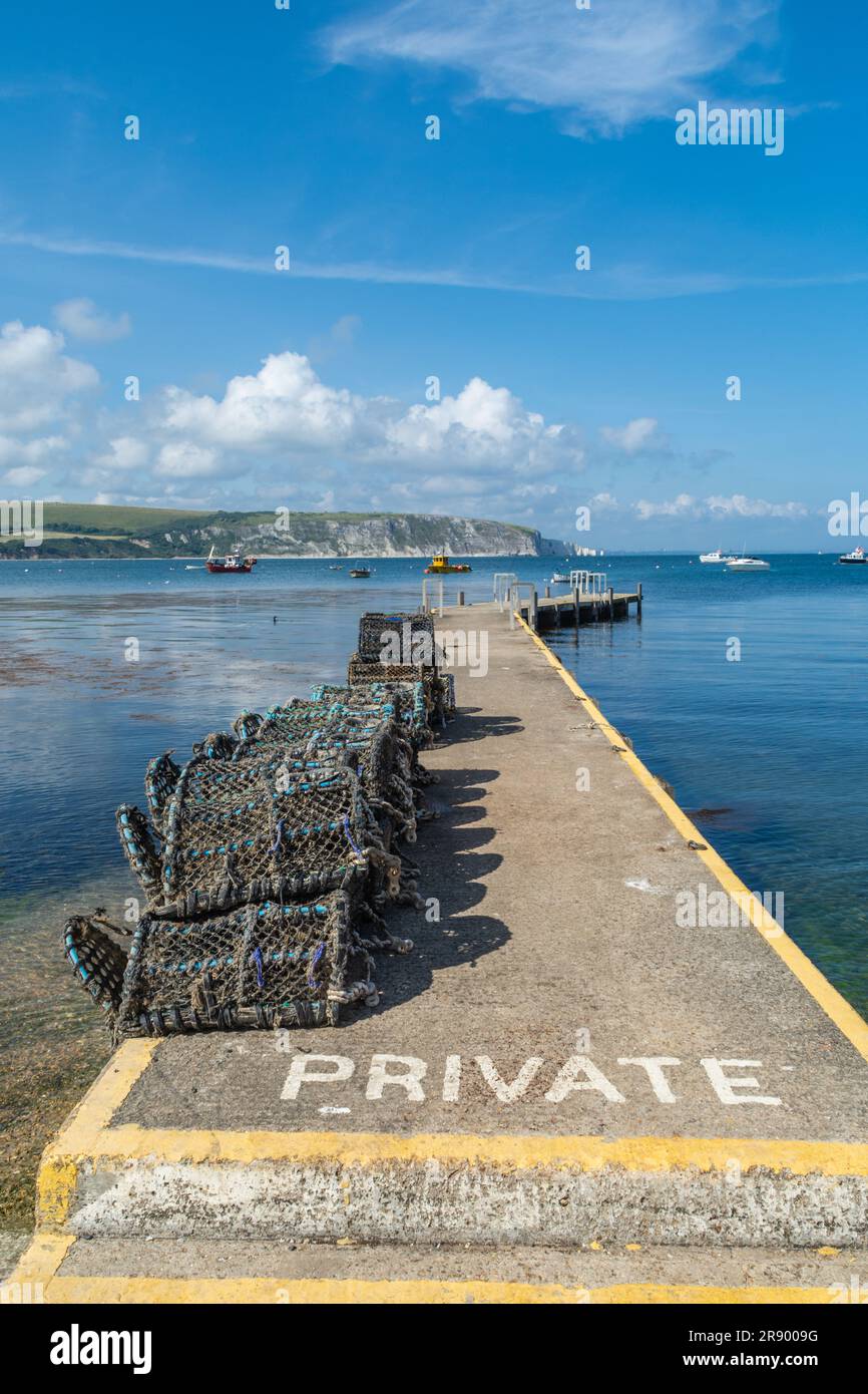 Peveril Point, Swanage, UK - June 21st 2023: Lobster pots on the jetty ...