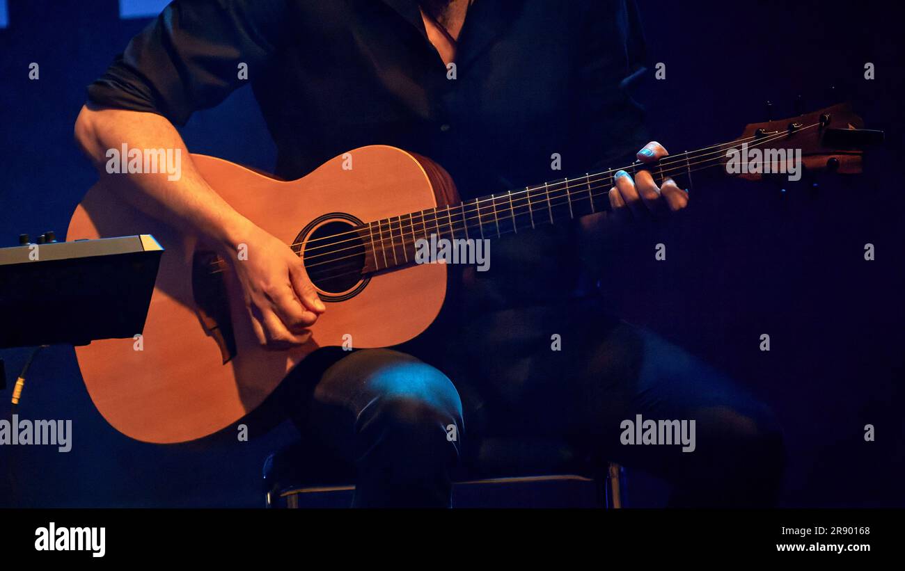 Image of male hands playing acoustic guitar Stock Photo - Alamy