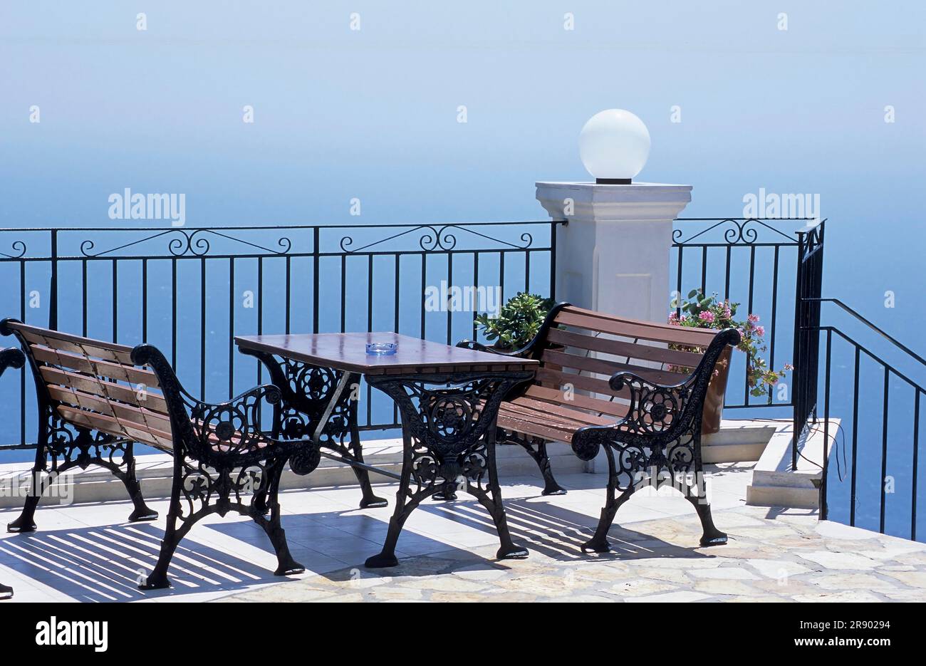 Cosy terrace with bench and table, Corfu, Lakones Stock Photo - Alamy