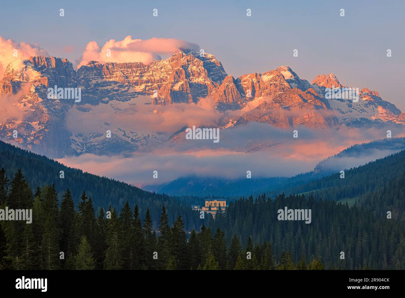 First morning light during sunrise at the Dolomite Mountains with the ...