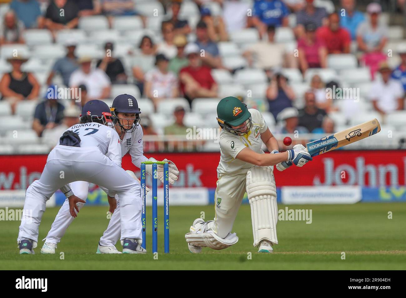 Kim Garth of Australia scoops for a boundary during the Metro Bank ...