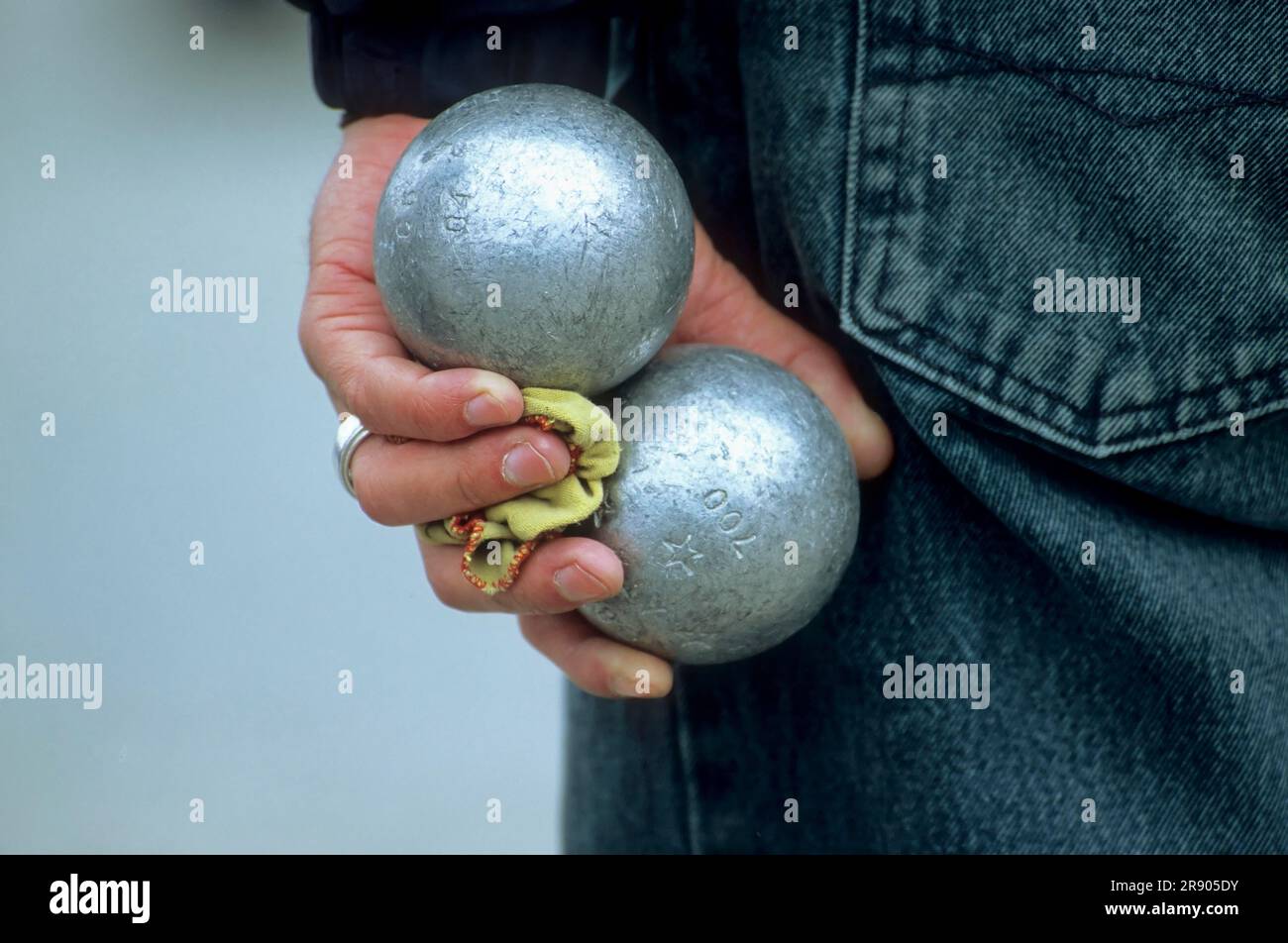 2 boules balls in the hand Stock Photo - Alamy