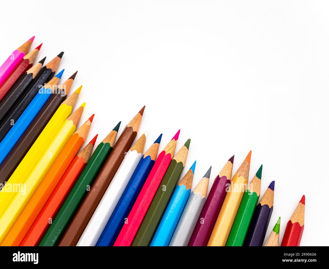 A vibrant collection of pencils arranged in a neat stack against a ...
