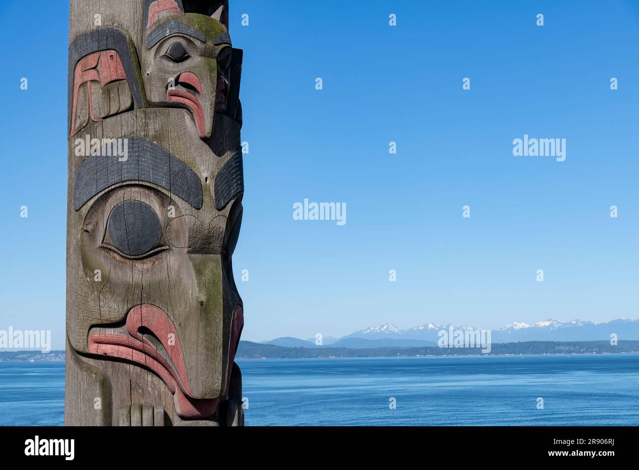 Seattle, WA, USA-July 2022; Close up view of part of a totem pole along ...