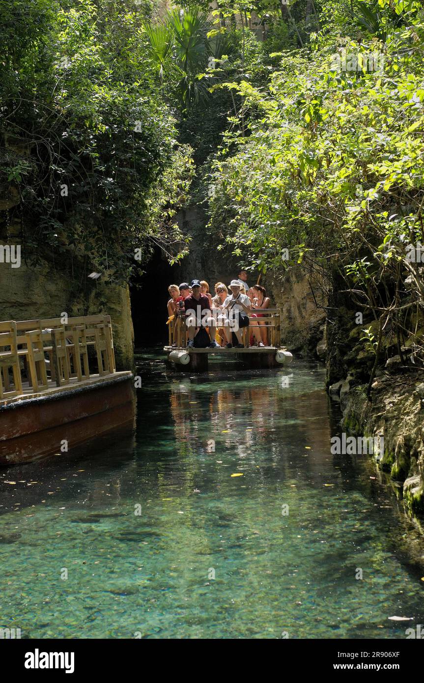 Tourists on a boat, on the Rio del Paraiso, Xcaret Ecological Park ...