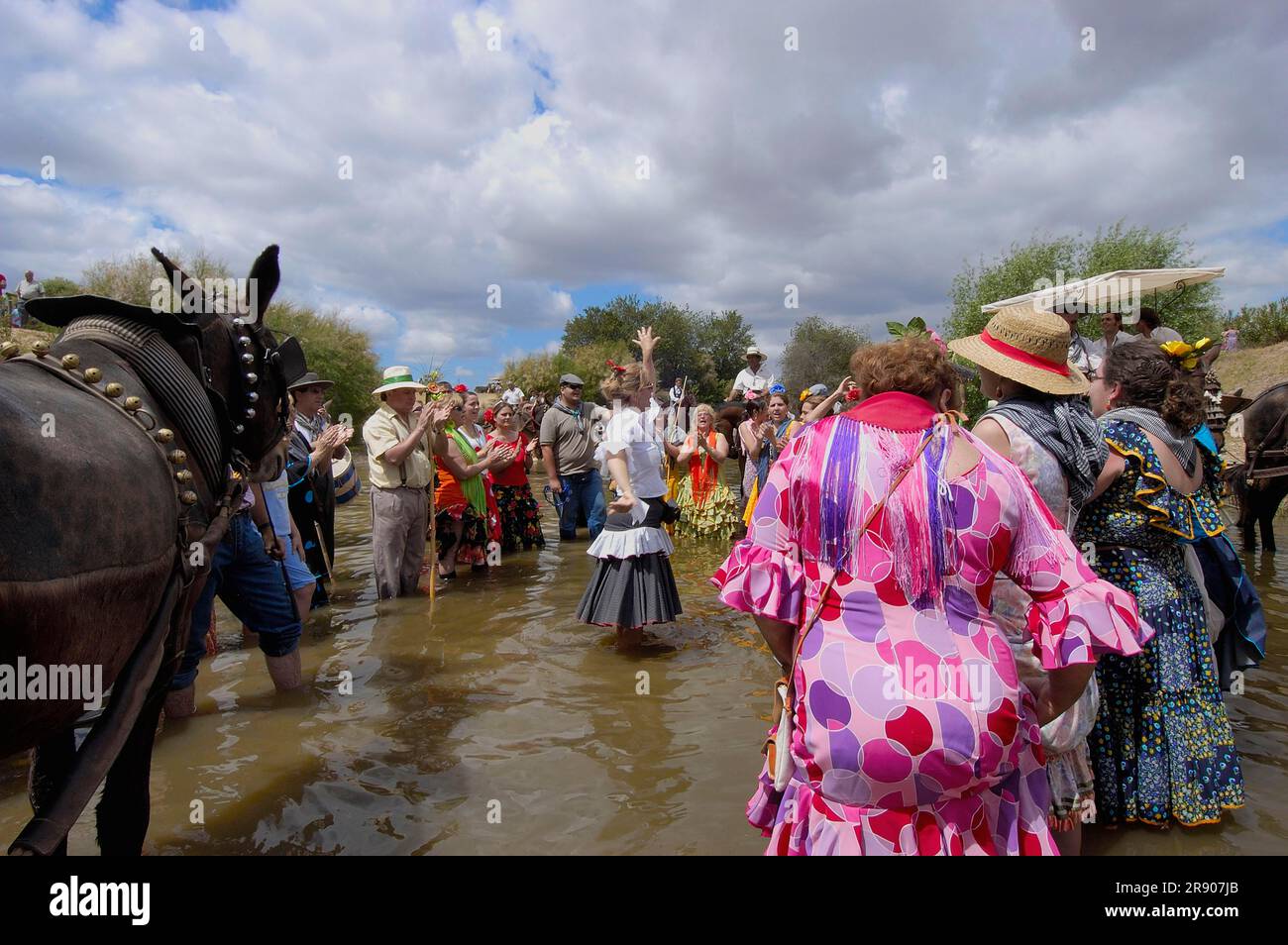 Pilgrims crossing the river Quema, Romeria pilgrimage to El Rocio ...