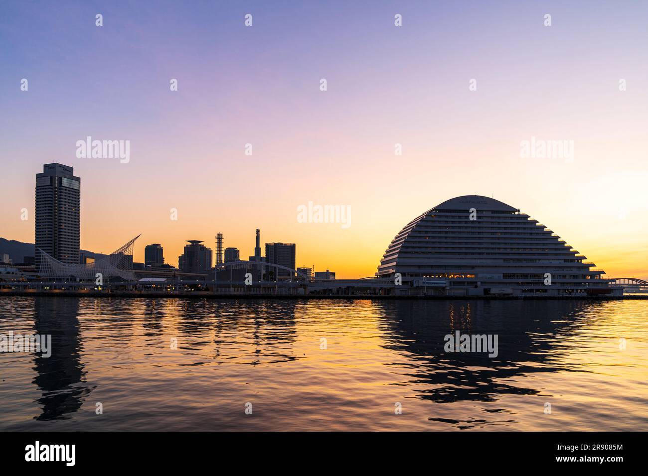 A clear dawn sky over the Kobe waterfront with the landmark Oriental ...