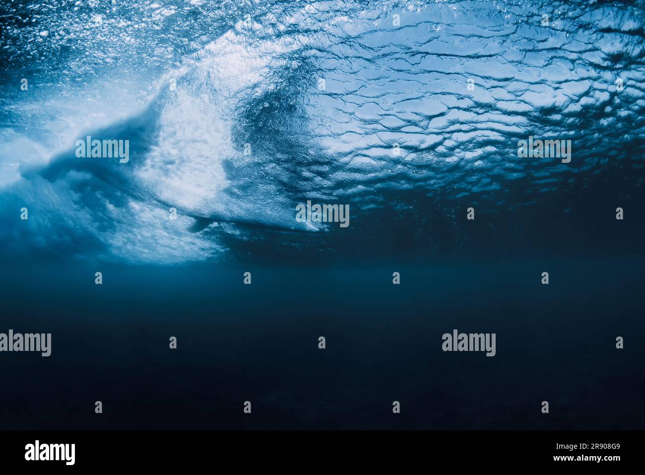 Wave underwater and surfer ride on surfboard in ocean. Underwater ...