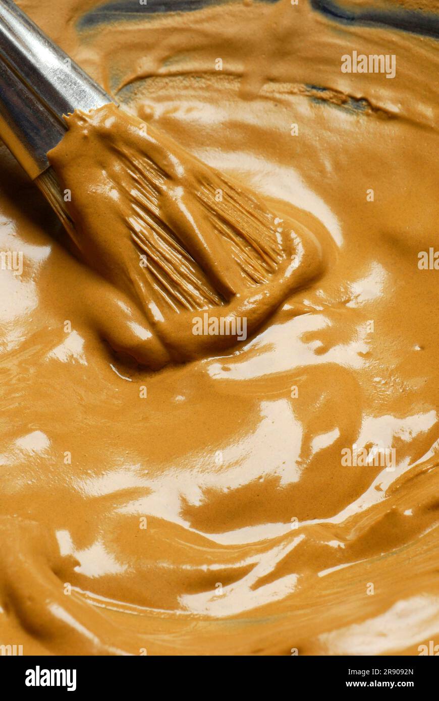 Red clay mixed with water, clay, healing clay, mix, stir Stock Photo ...