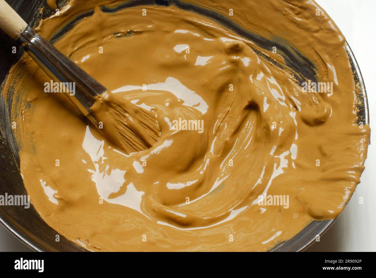 Red clay mixed with water, clay, healing clay, mix, stir Stock Photo ...