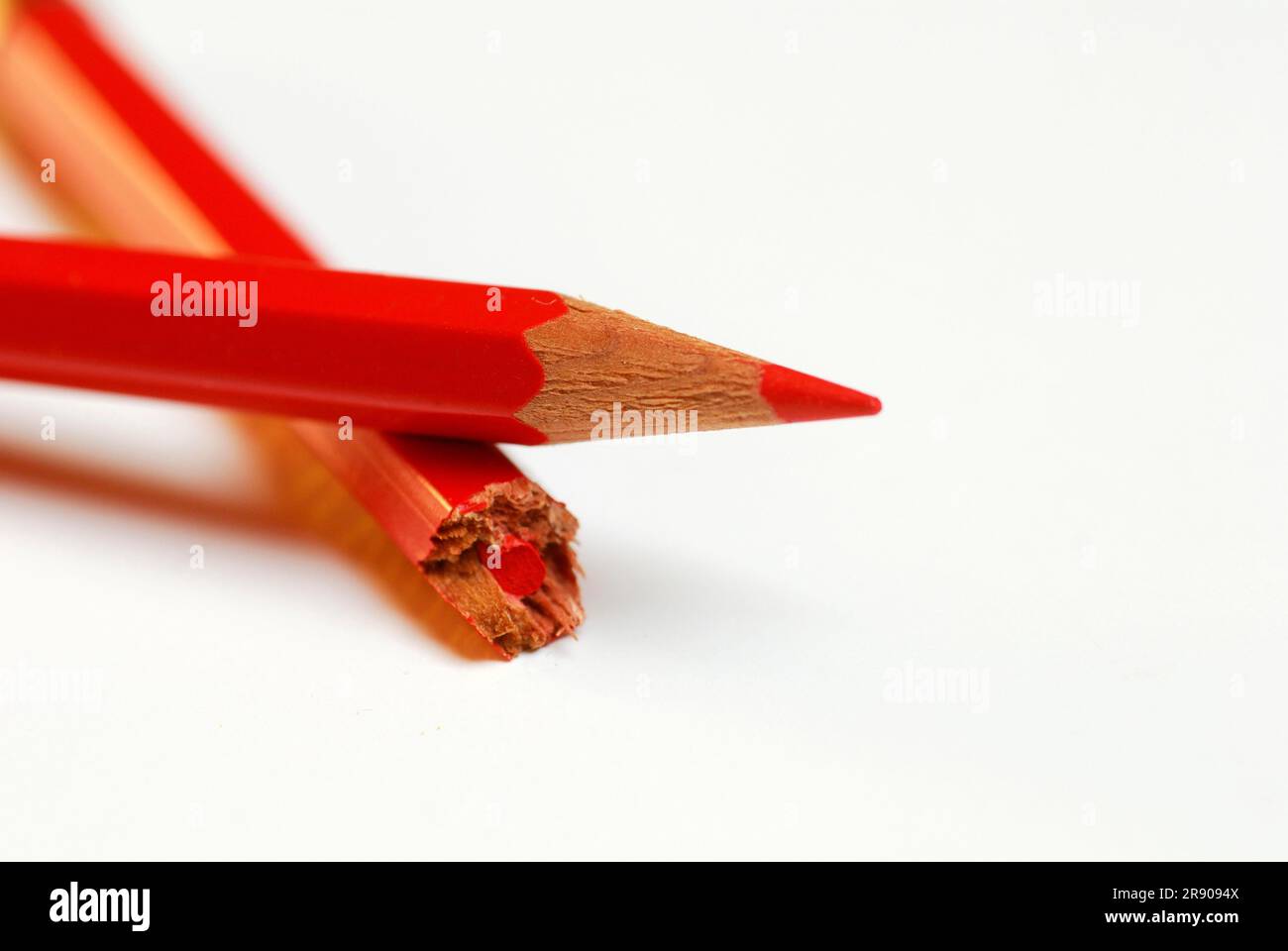 Red crayon, broken Stock Photo - Alamy