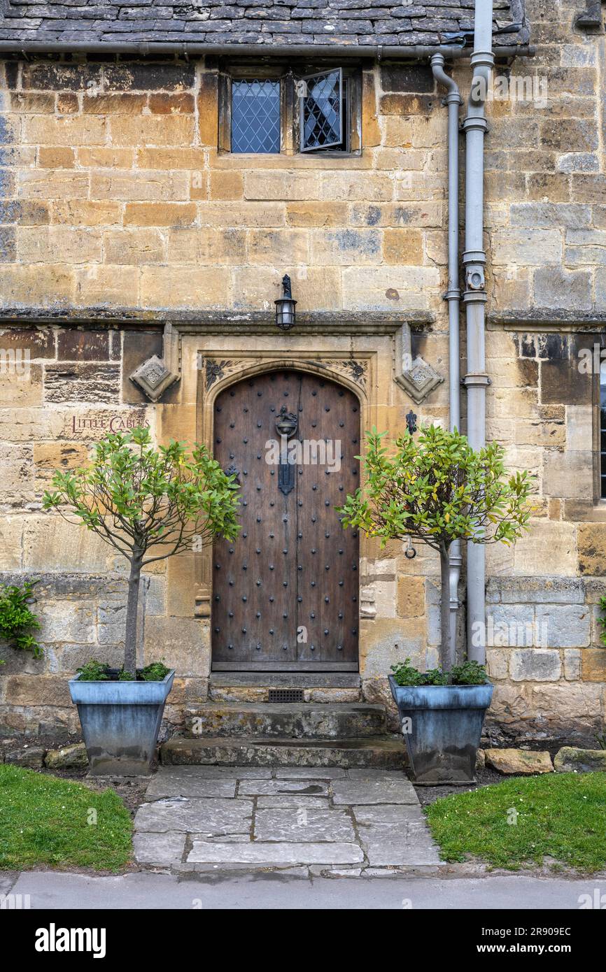 Old stone house in detail with old wooden front door, Broadway ...