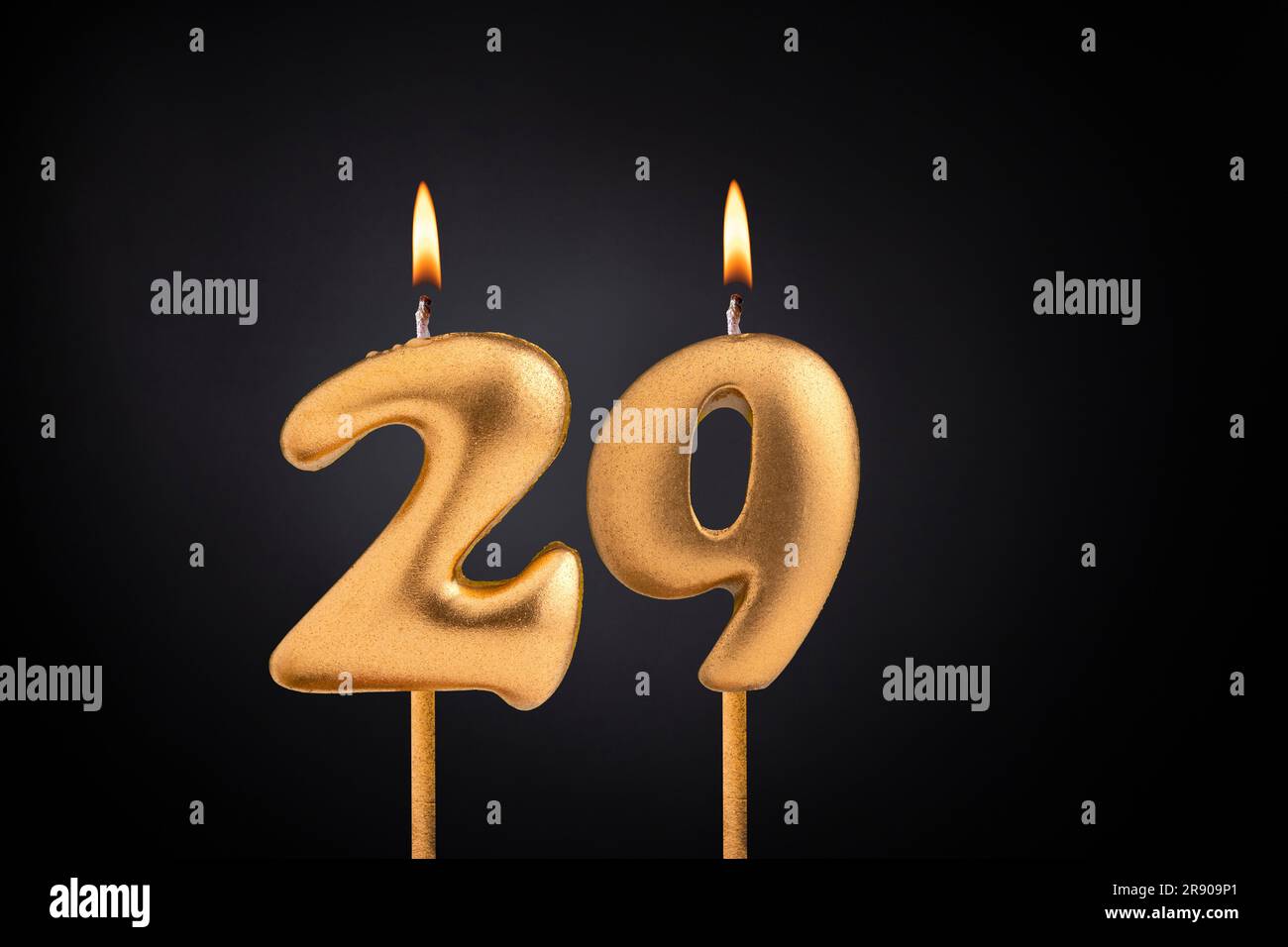 Golden candle 29 with flame - Birthday card on dark luxury background ...