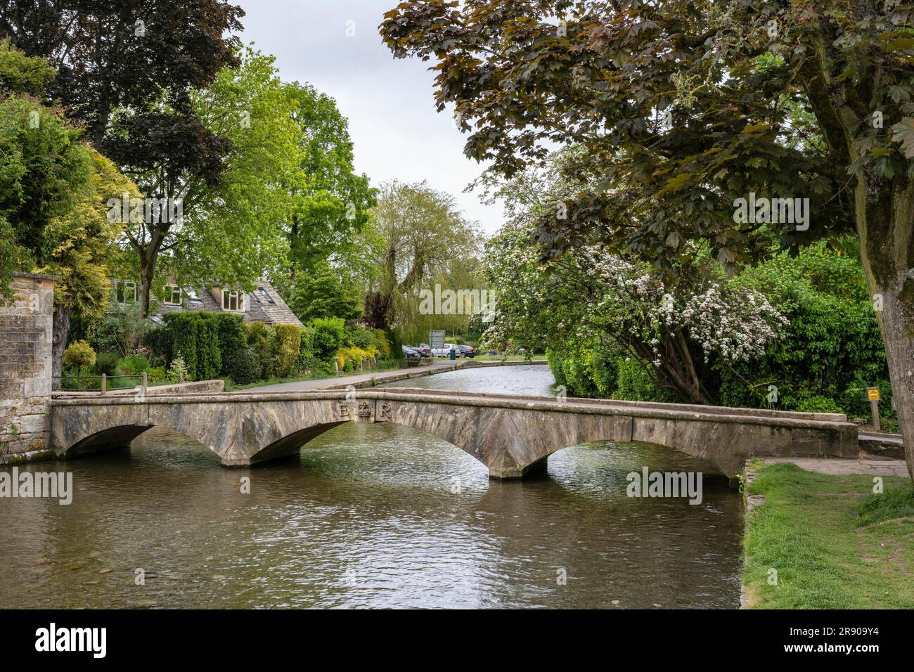 Old footbridge over the River Windrush in the Old Town of, Bourton on ...