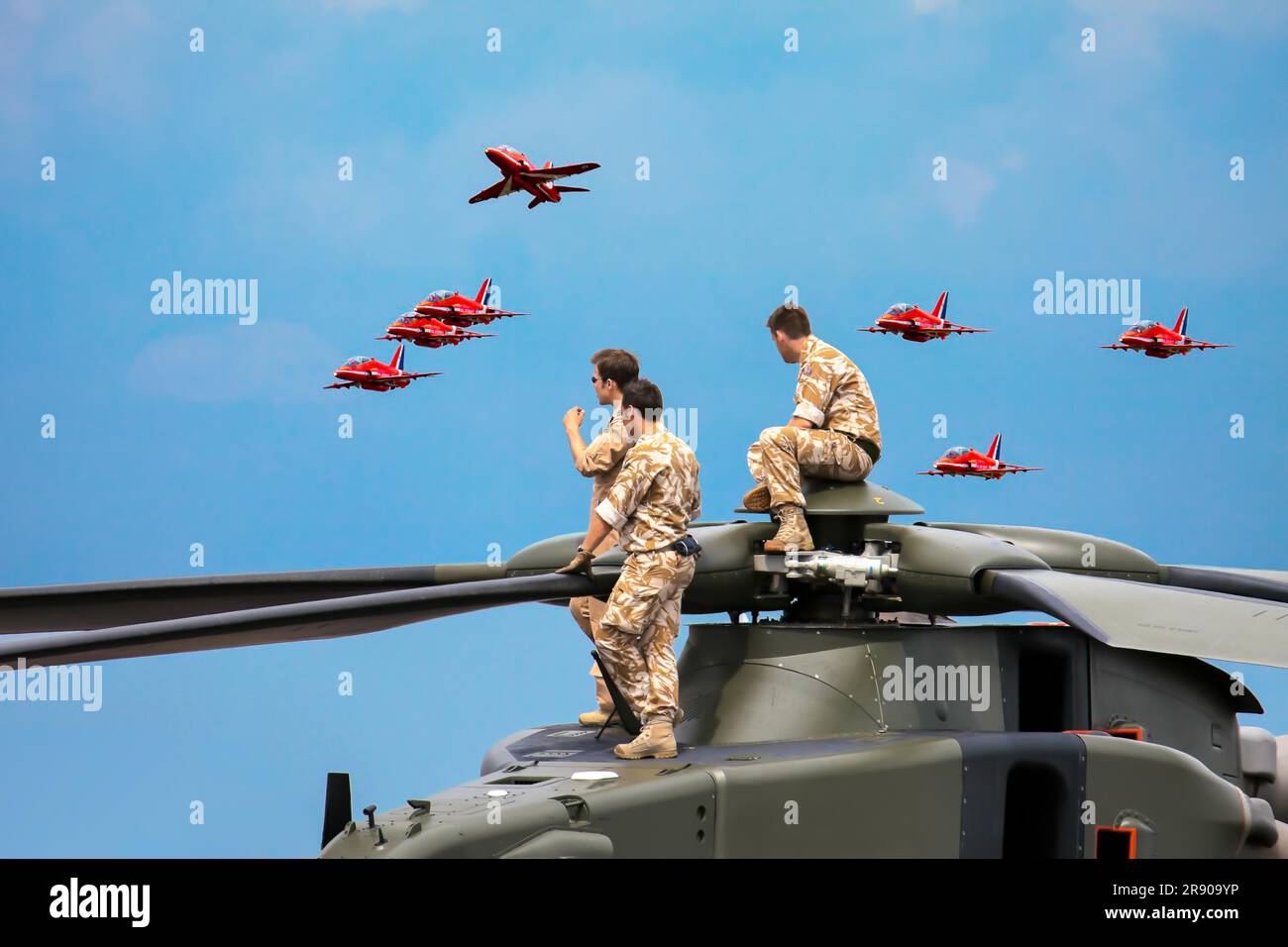 Helicopter Crew Watching the Red Arrows Display Stock Photo - Alamy