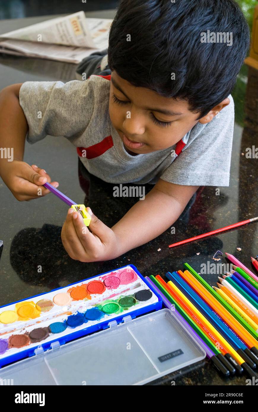 Three-year-old Indian boy child sharpening pencil, Karnataka, South ...