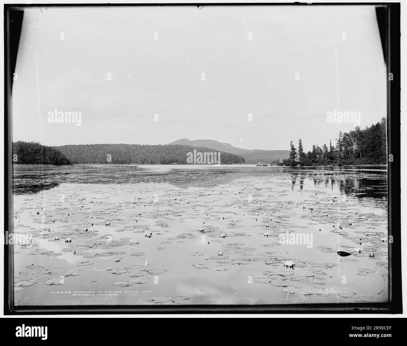Saranac River and Round Lake, Adirondack Mountains, c1902 Stock Photo ...