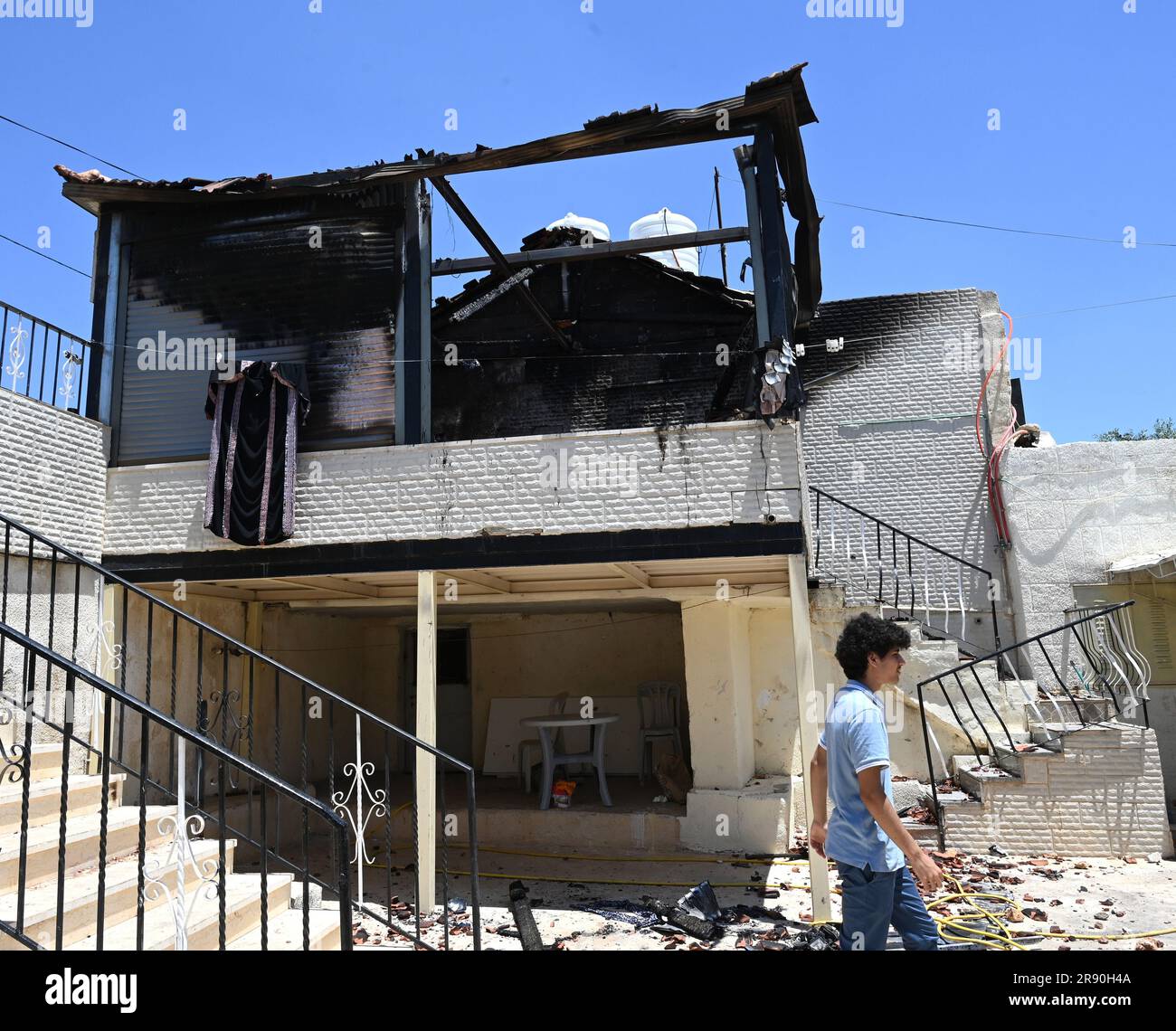 Turmus Ayya, West Bank. 23rd June, 2023. A boy walks by the house of ...