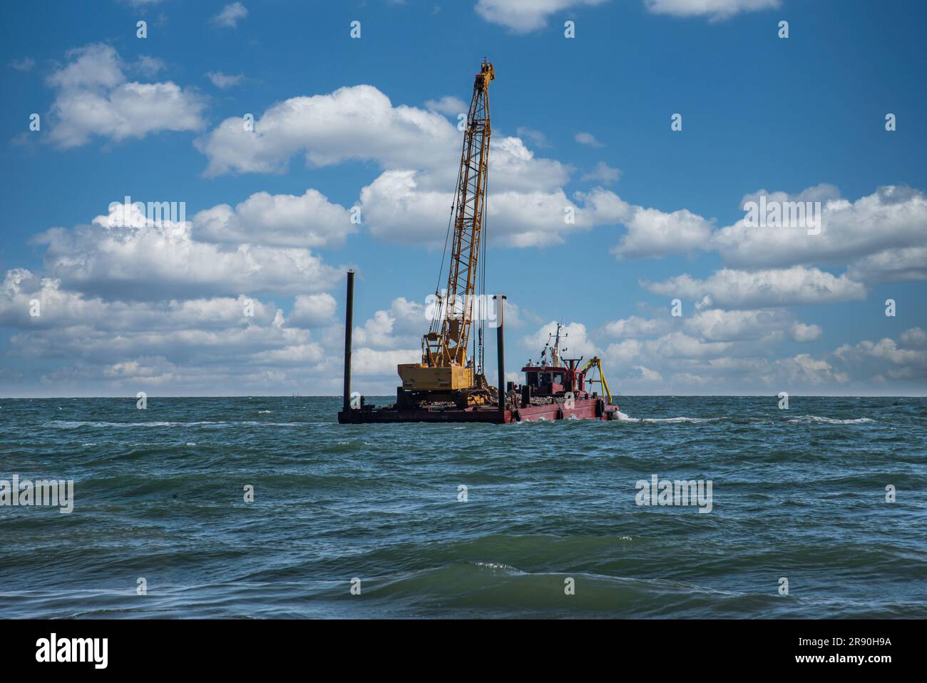 barge for transporting large rocks for the construction of breakwaters ...
