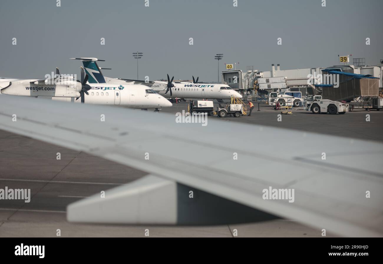 Westjet airplanes on the service ramp at Calgary Airport in Alberta ...