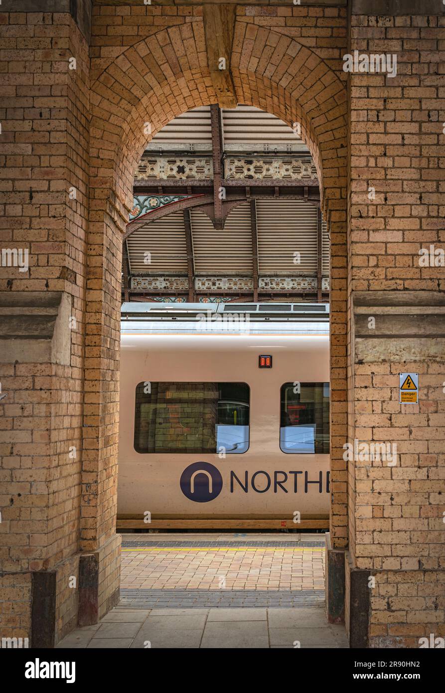 The carriage of a train framed by a brick arch. A part of a 19th ...