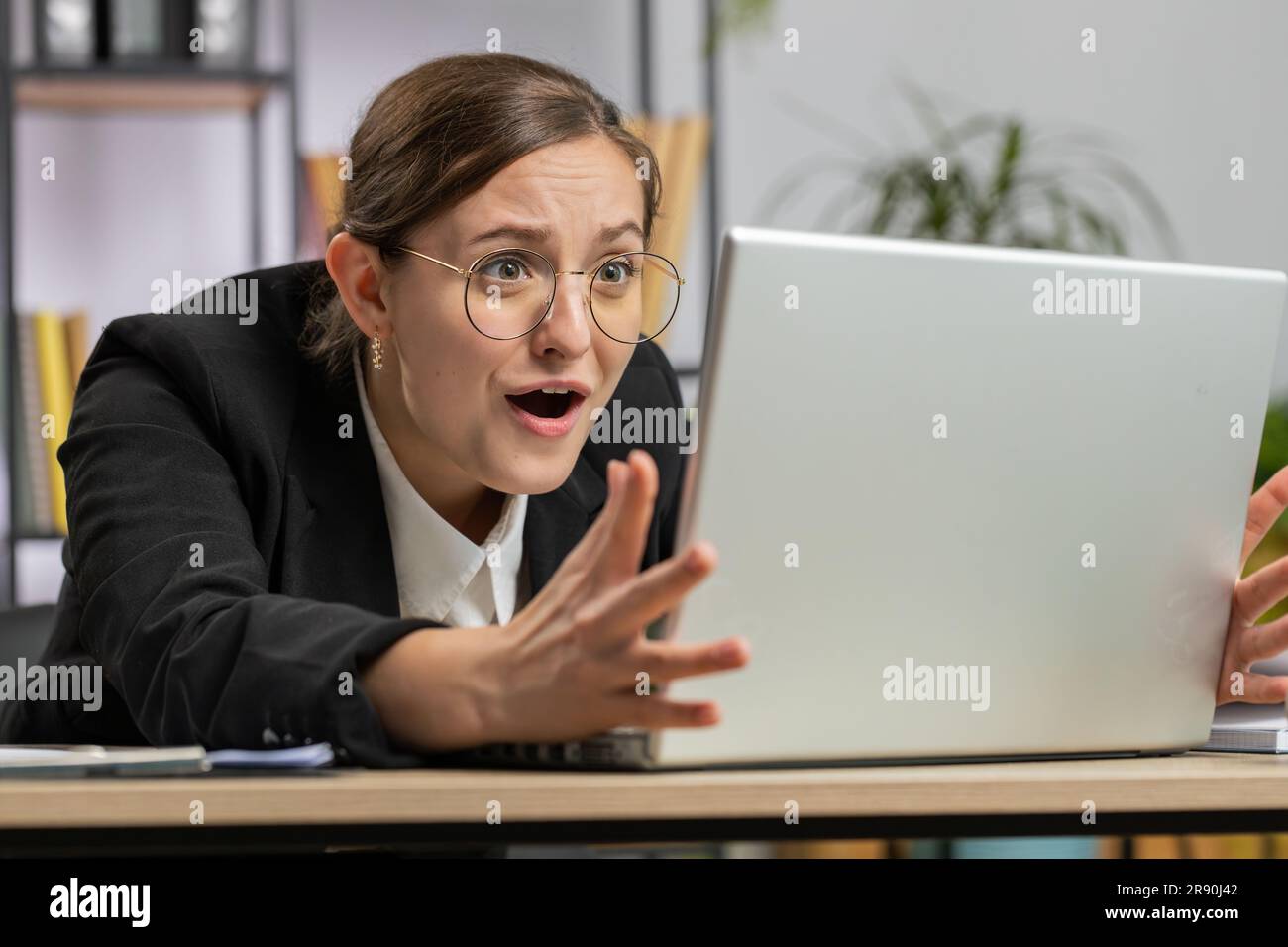 Angry business woman breaking laptop hi-res stock photography and ...