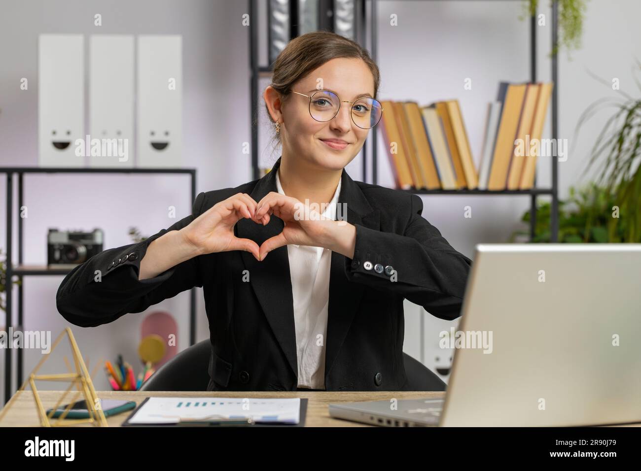 I love you. Caucasian business woman makes symbol of love, showing ...