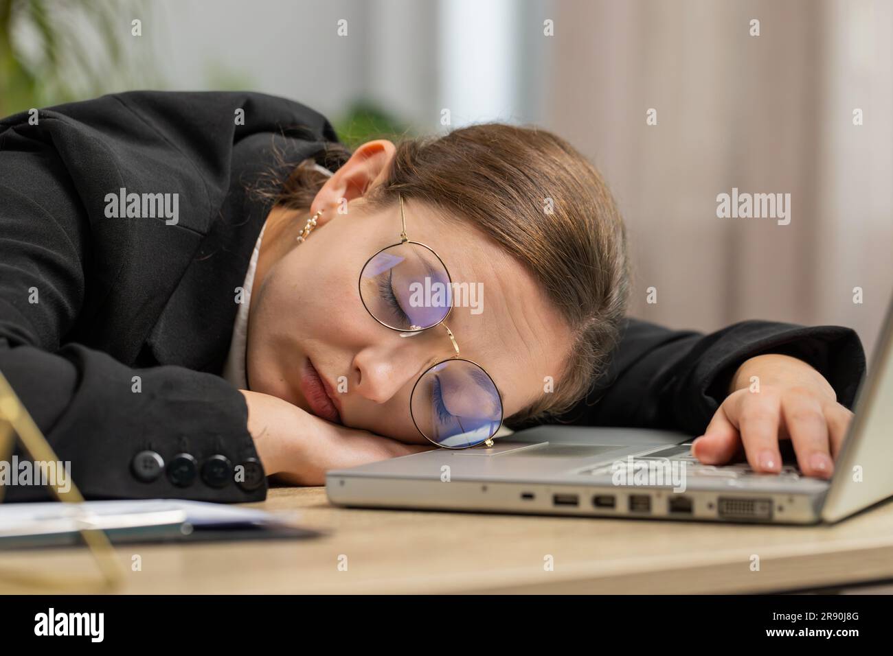 Bored sleepy Caucasian business woman in glasses worker working on ...