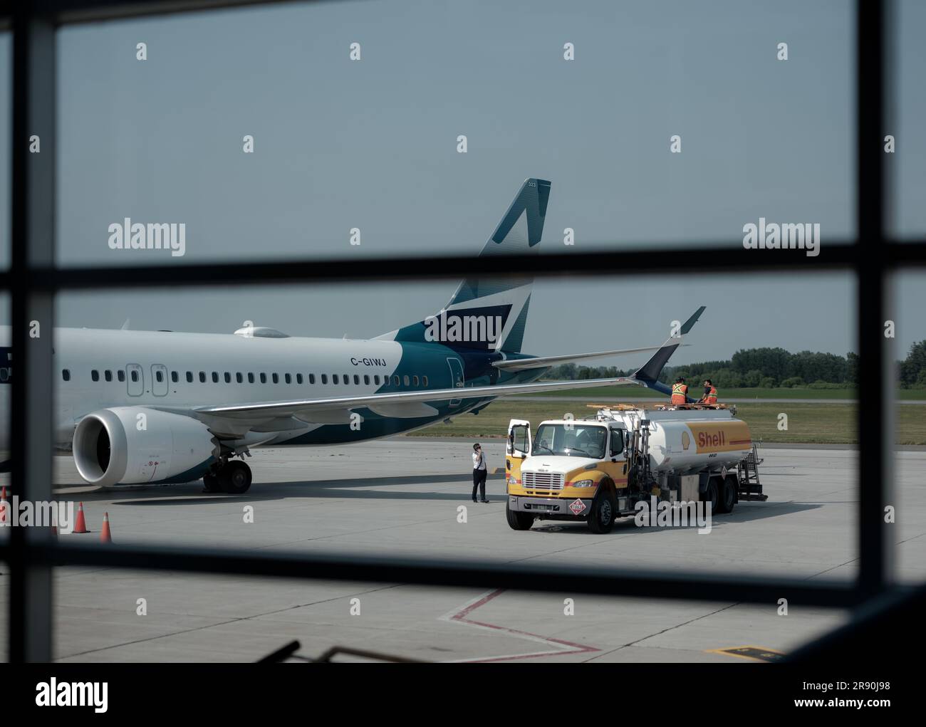 Westjet airplanes on the service ramp at Calgary Airport in Alberta ...