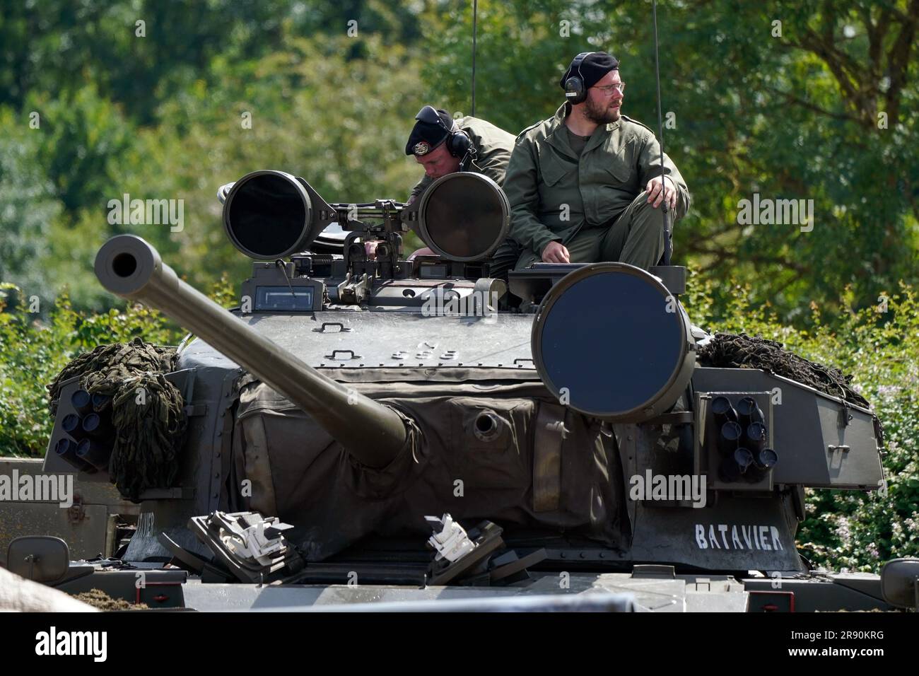 A tank crew sit in their Centurion tank as they wait to enter the ...