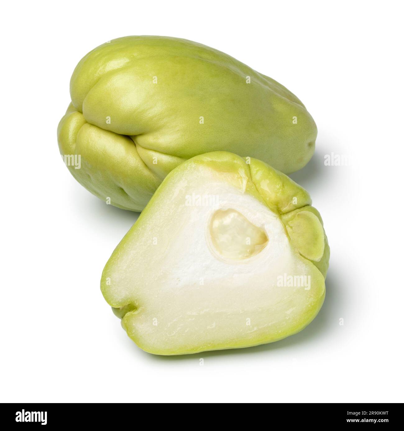 Whole and halved fresh chayote isolated on white background close up ...