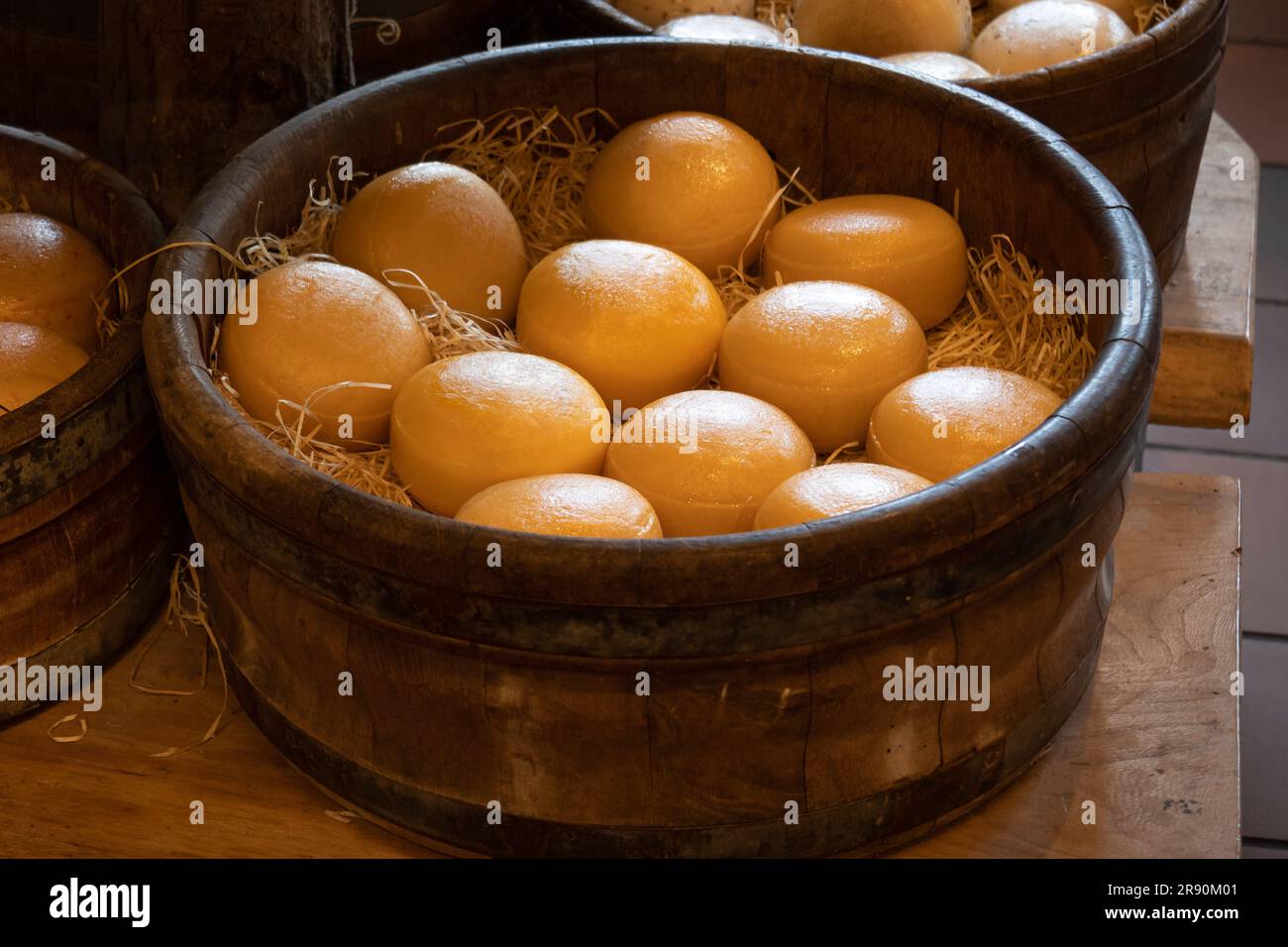Wooden barrel with traditional small dutch cheeses for sale Stock Photo ...