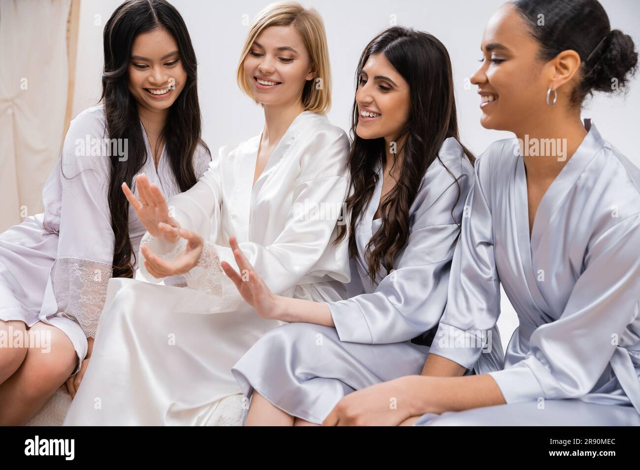 bridal party, silk robes, best friends, bride with her multicultural ...