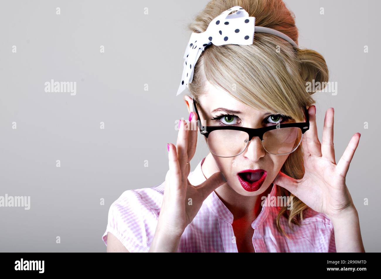 Beautiful blonde Pin-Up girl with a shocked face. Effect WOW Stock ...