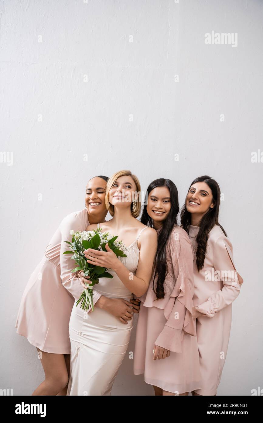 positivity, happy interracial bridesmaids hugging bride in wedding ...