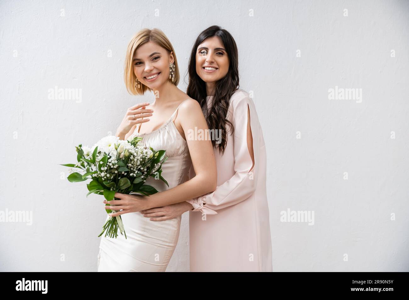special occasion, cheerful bridesmaid hugging bride, friendship goals ...
