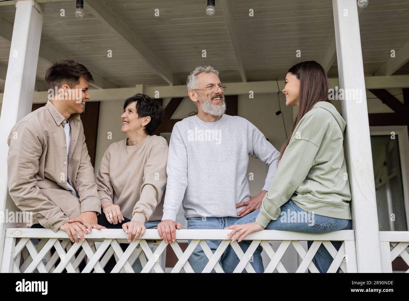 parents day, middle aged parents chatting with teenage daughter and ...