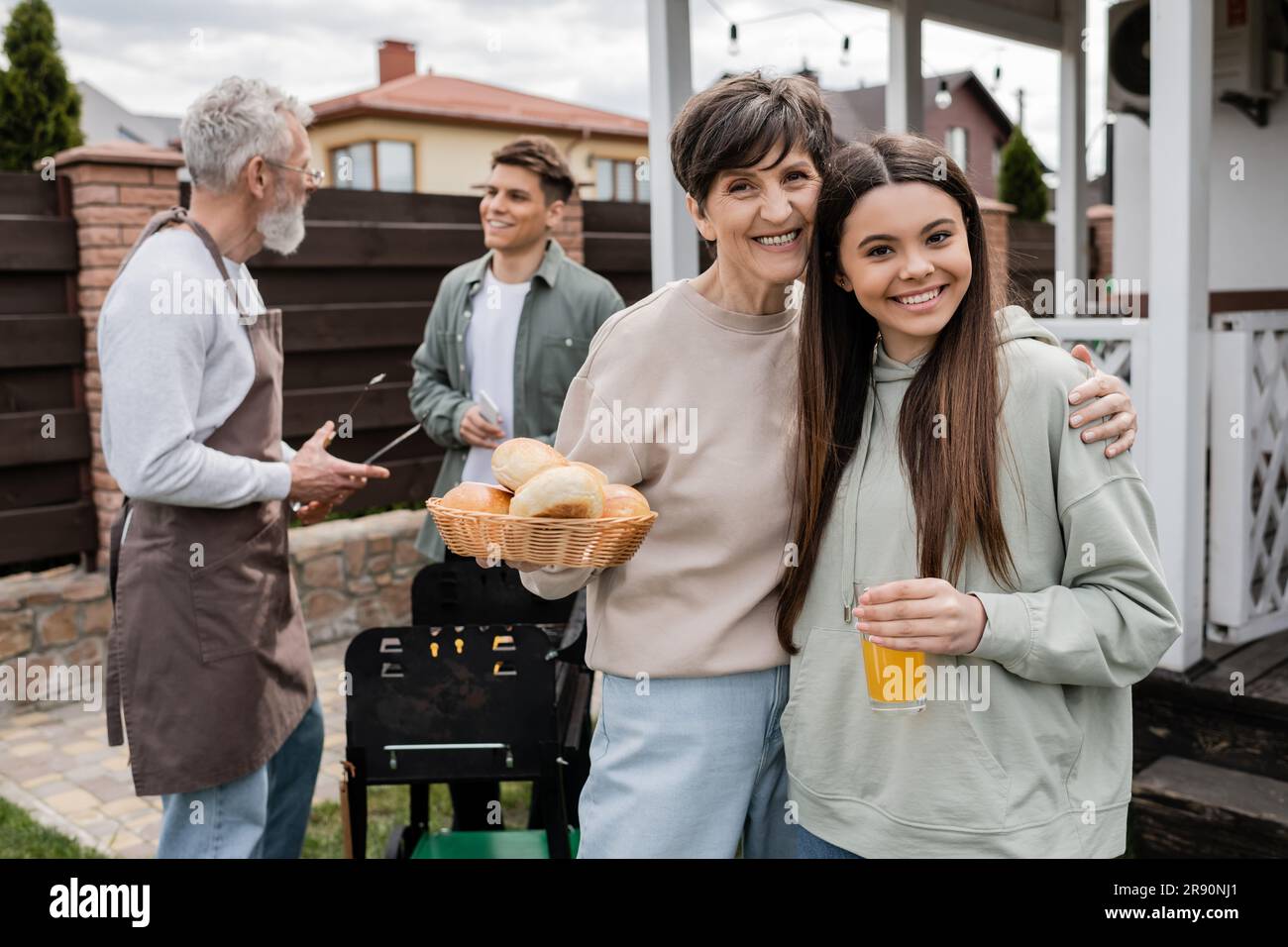 modern parenting, celebration of parents day, happy middle aged mother ...