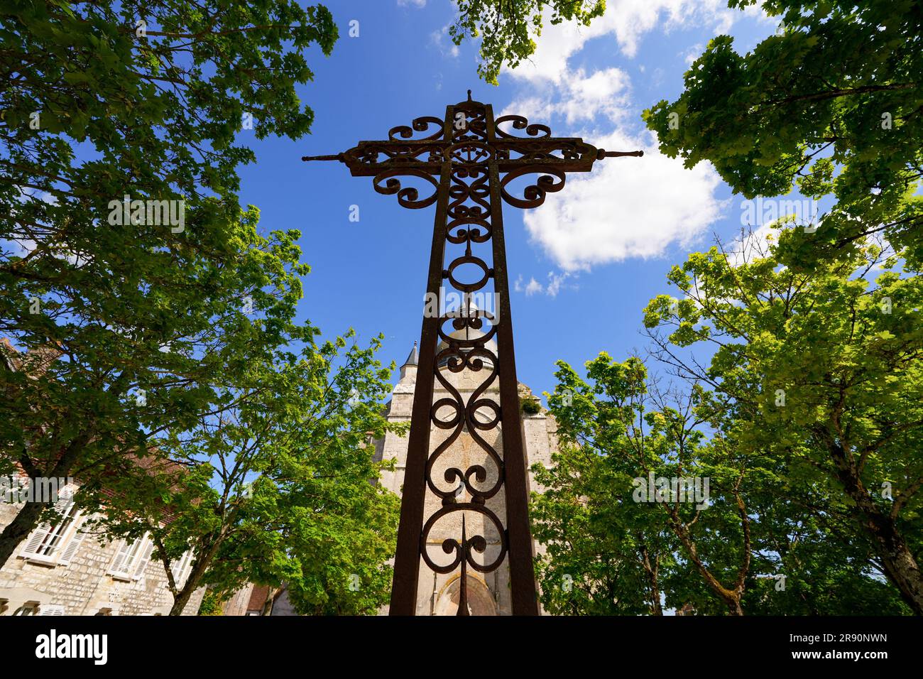 Wrought iron cross in the square in front of Saint Quiriace Collegiate ...