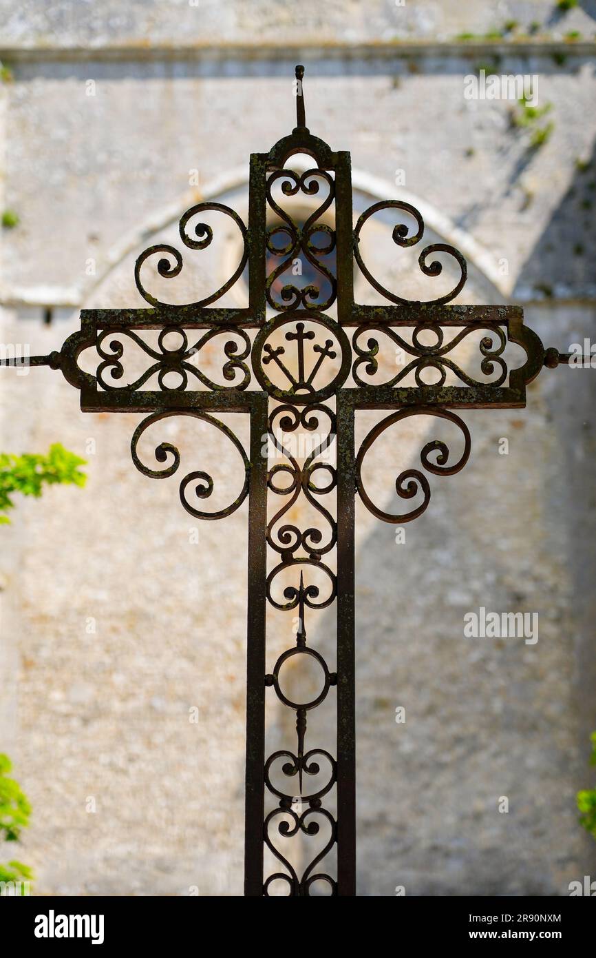 Wrought iron cross in the square in front of Saint Quiriace Collegiate ...