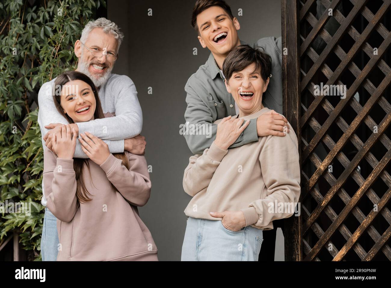 Woman in green hugging celebrating hi-res stock photography and images ...