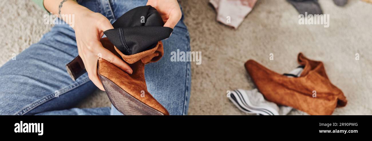 Holding boot woman hi-res stock photography and images - Alamy