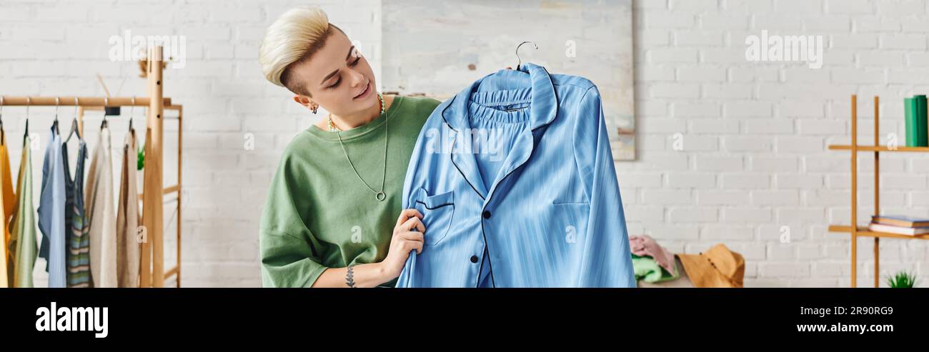 clothing sorting, home decluttering, tattooed woman with trendy ...