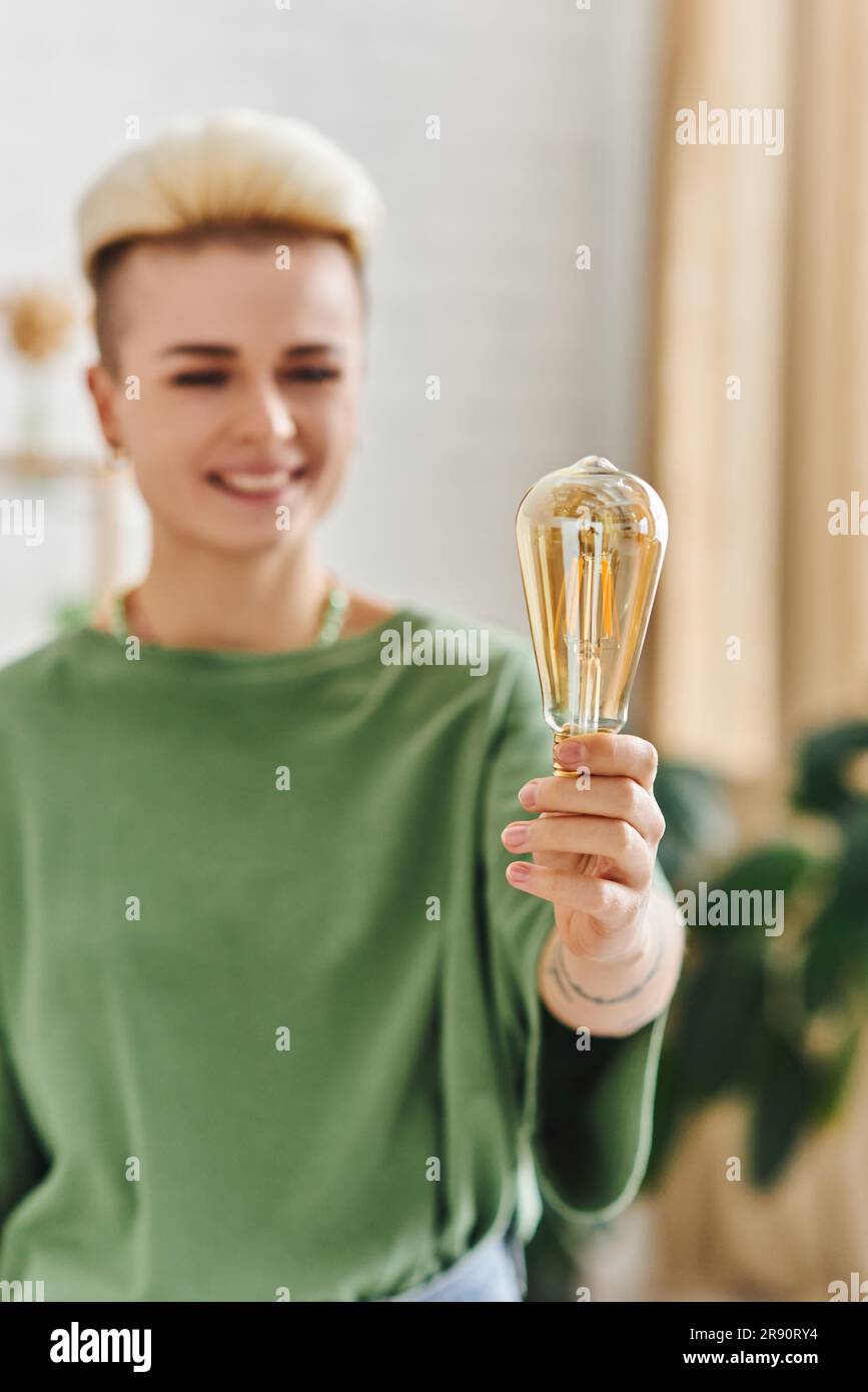 cheerful woman with trendy hairstyle, in casual clothes smiling and ...