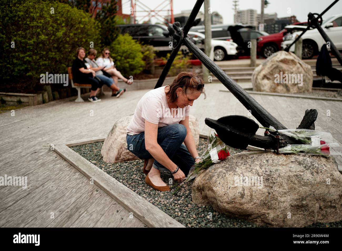St John's resident Patsy Power places flowers at an anchor at King's ...